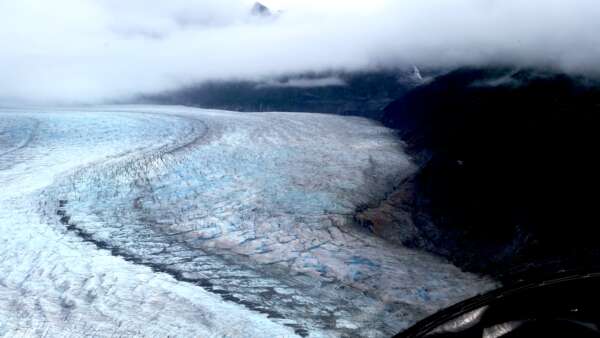 Helicopter Flying over the Magnificent Juneau Icefield in Alaska